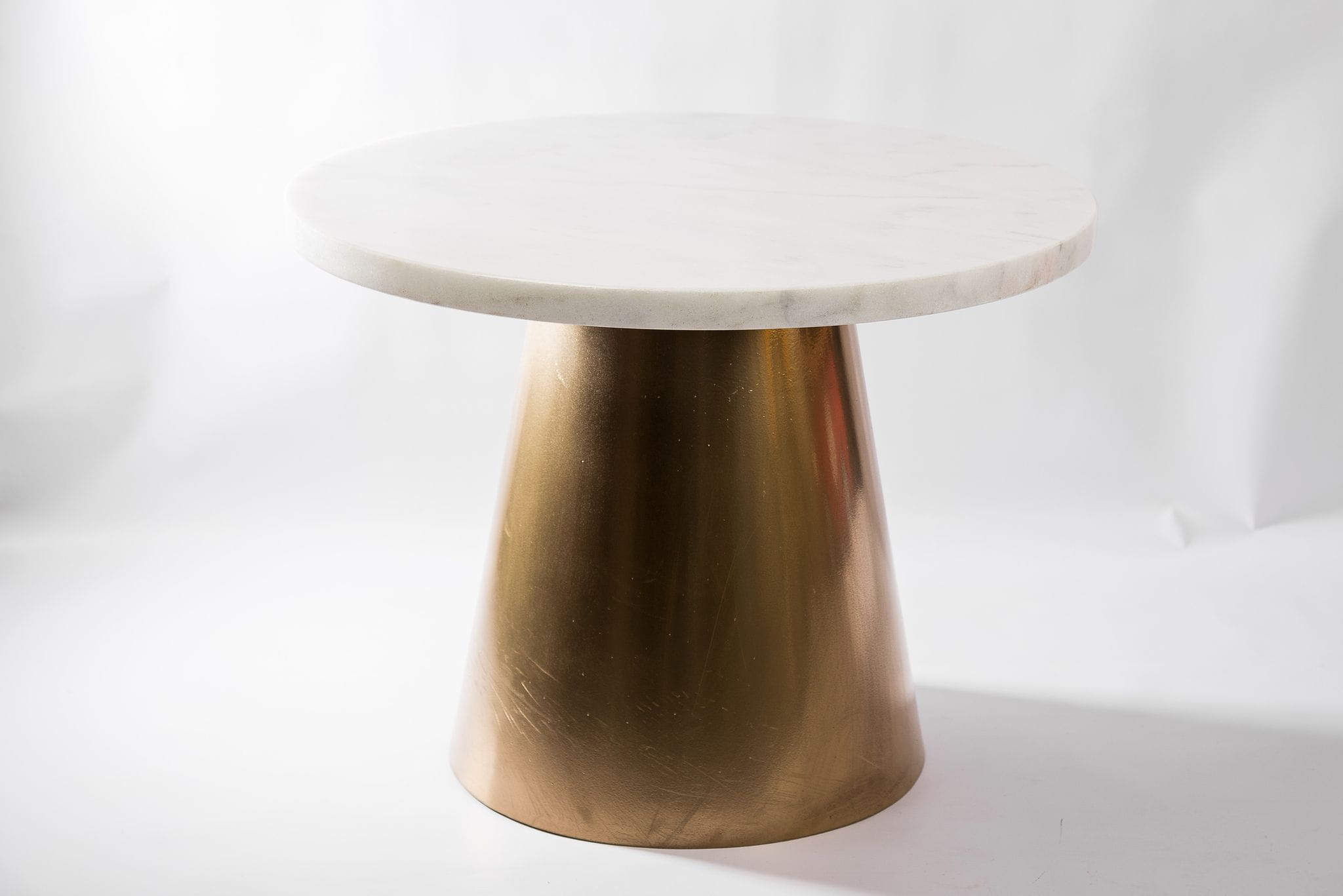 Camden Marble Round Table 60x45 cm a circular table featuring a marble ...